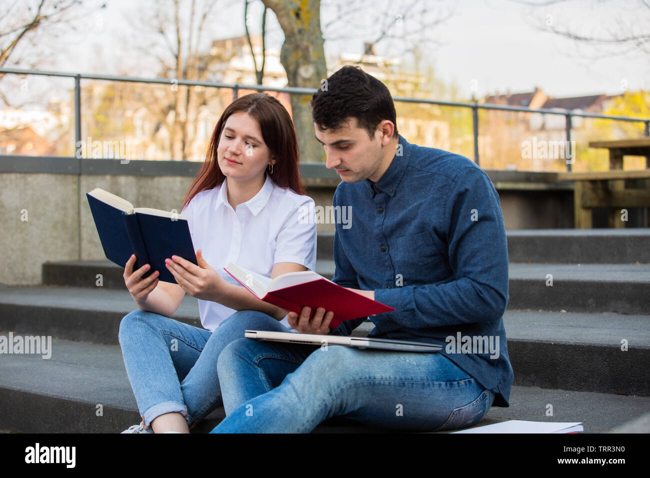 Happy Students using laptop and books learning for the exam Students ...
