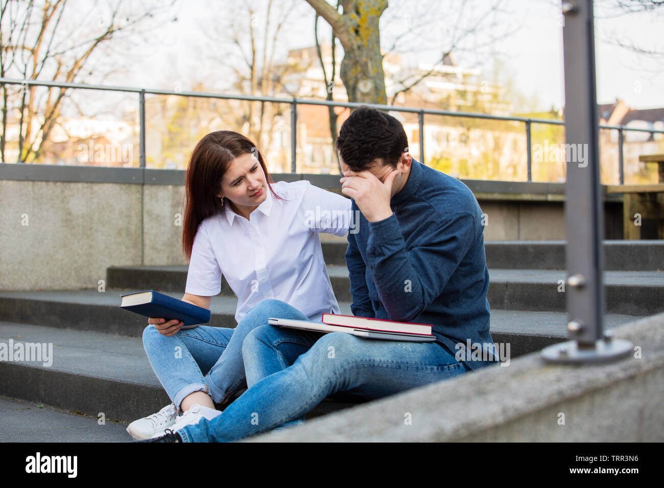 Classmate helping friend hi-res stock photography and images - Alamy