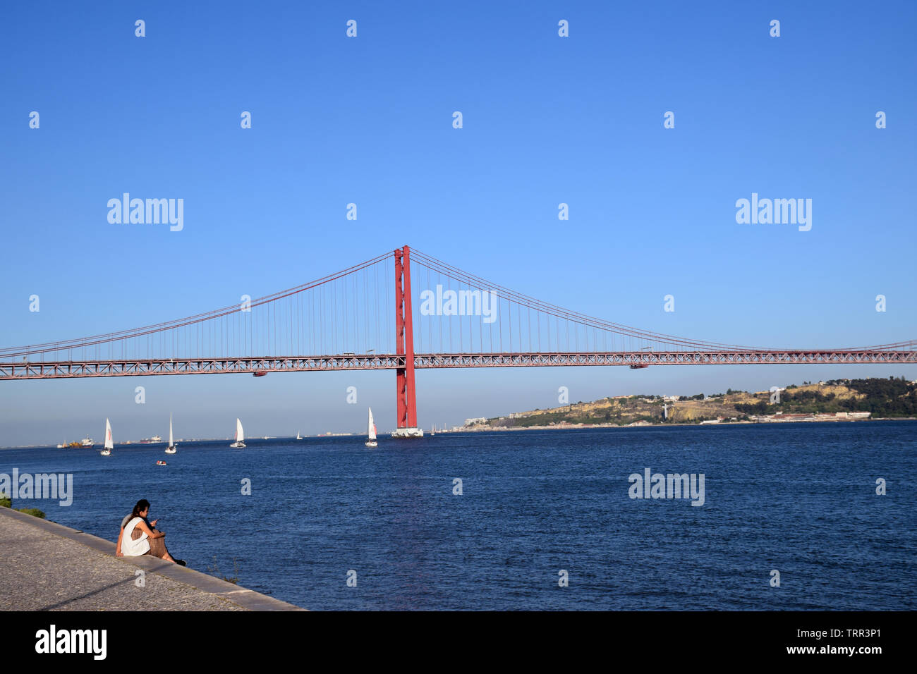 The Ponte 25 de Abril suspension bridge over Tagus River, Lisbon ...