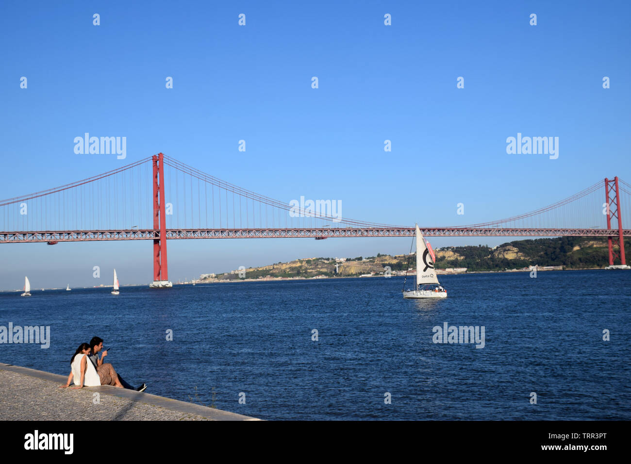 The Ponte 25 de Abril suspension bridge over Tagus River, Lisbon ...
