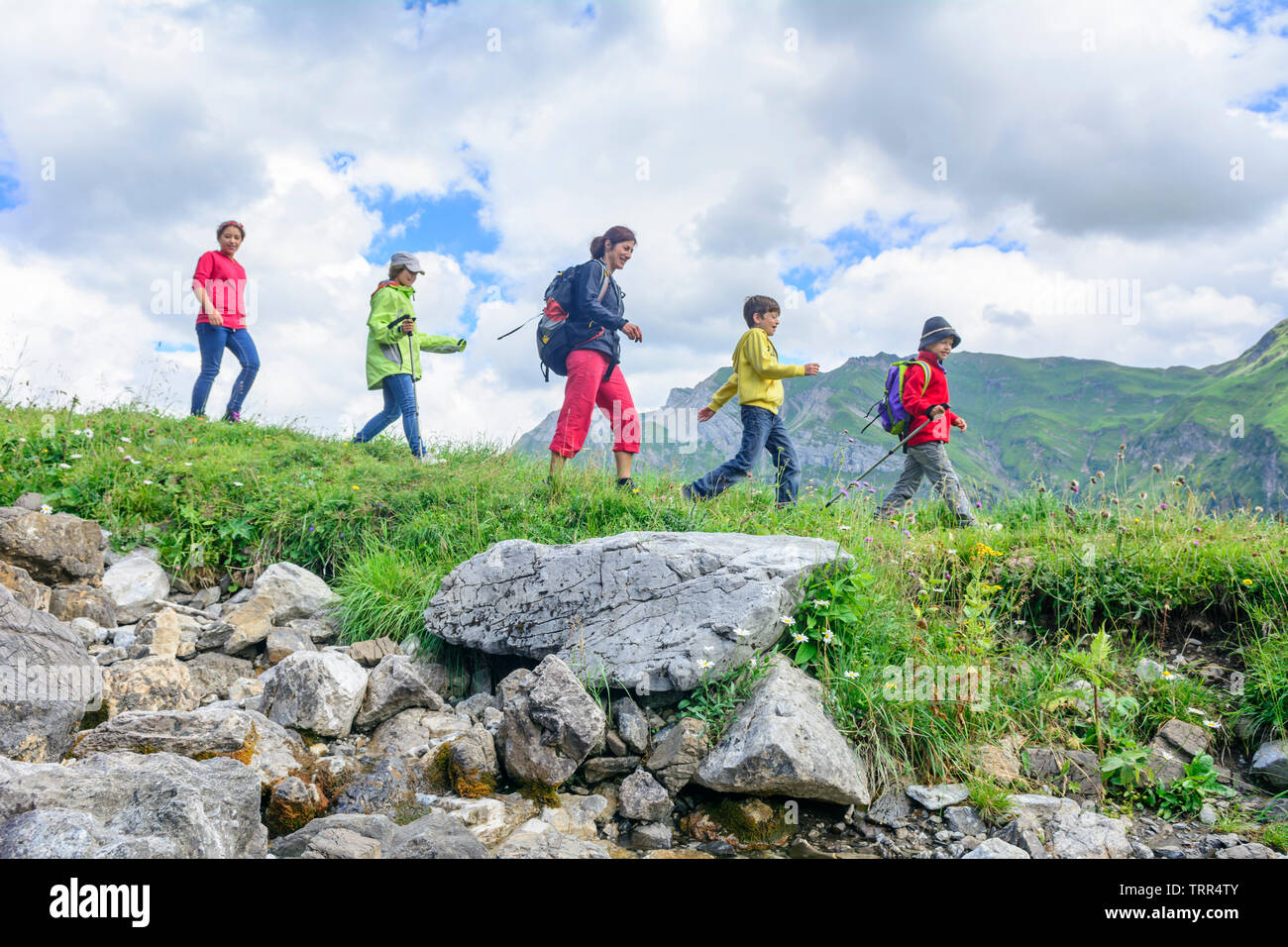 A group of teenagers doing a hiking tour with a woman Stock Photo - Alamy