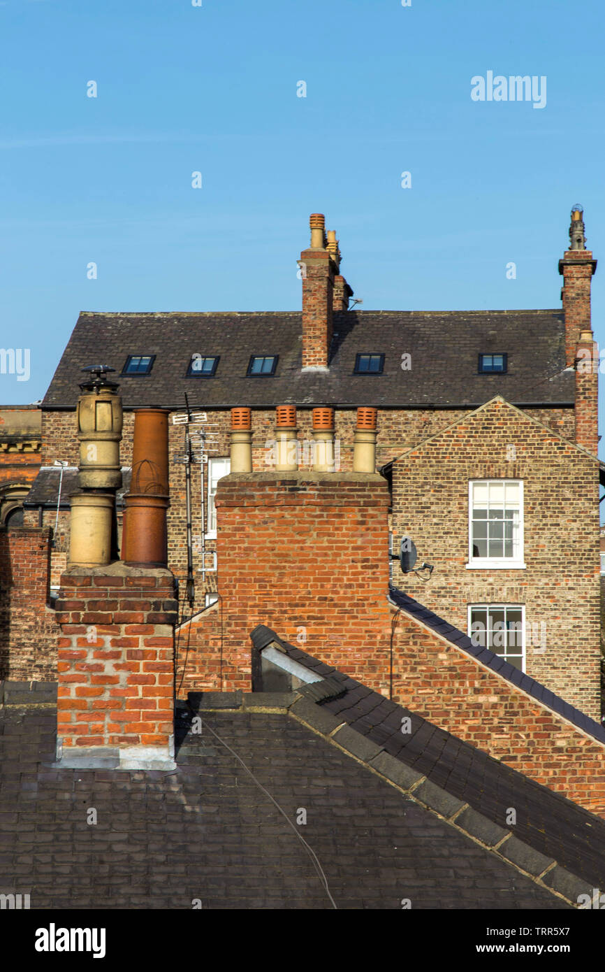 Old roofs and typical chimneys pots in York, Yorkshire, England, UK ...