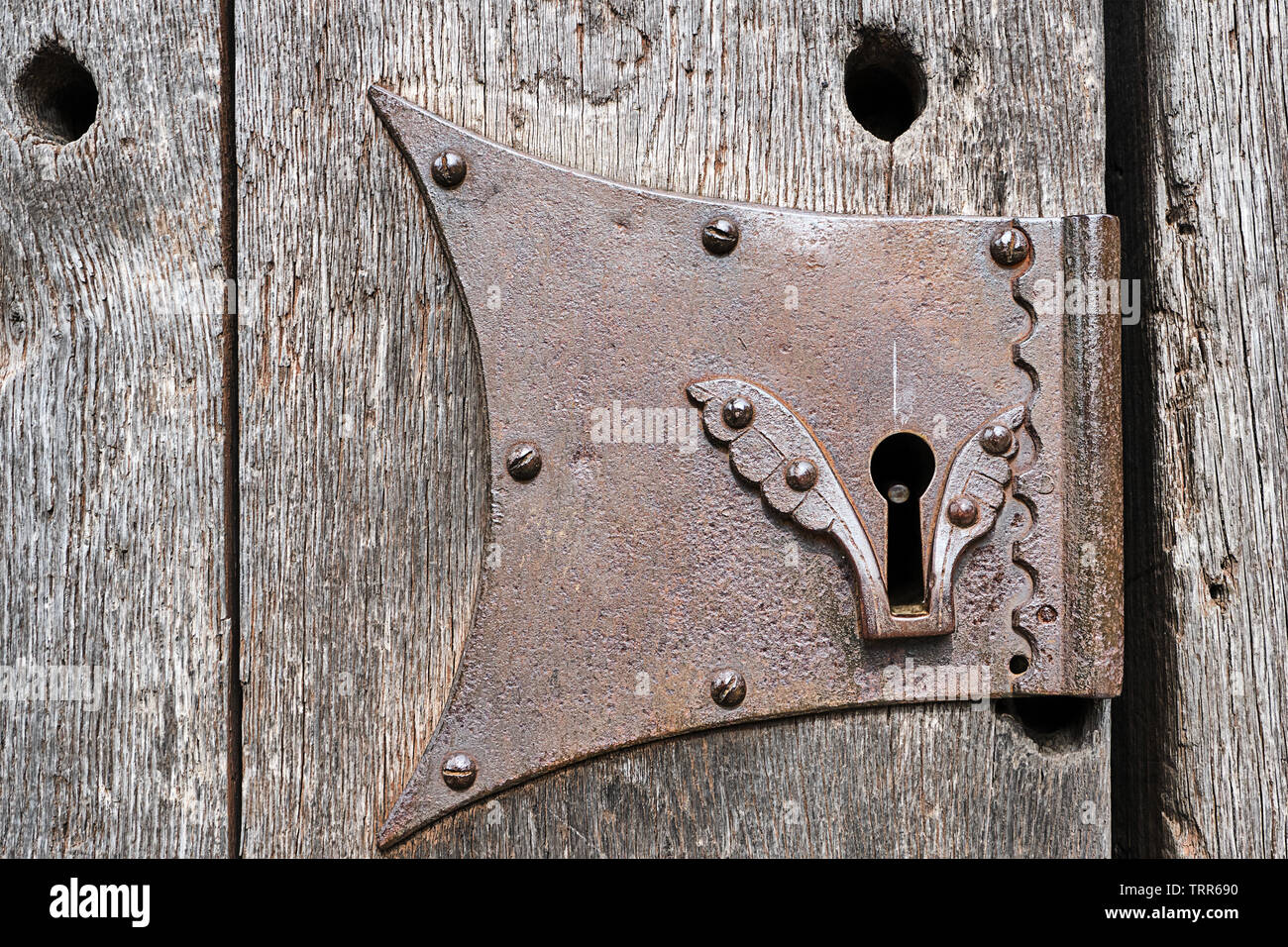 Detail of a keyhole of an old wooden door Stock Photo - Alamy