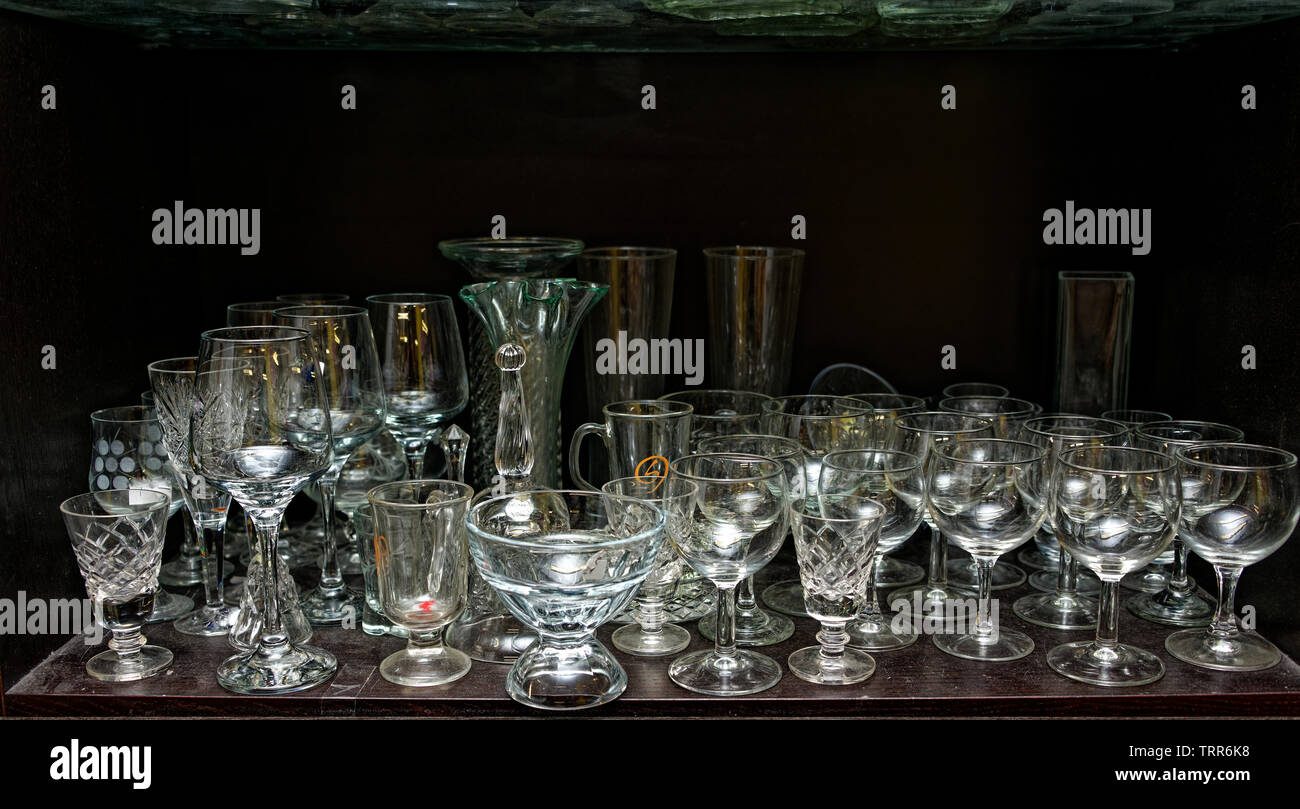The set of glasses on the shelf Stock Photo - Alamy