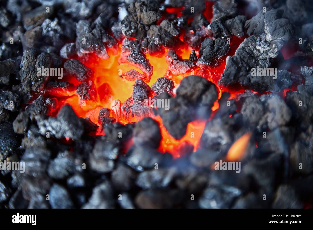 Embers in forge fire Stock Photo - Alamy