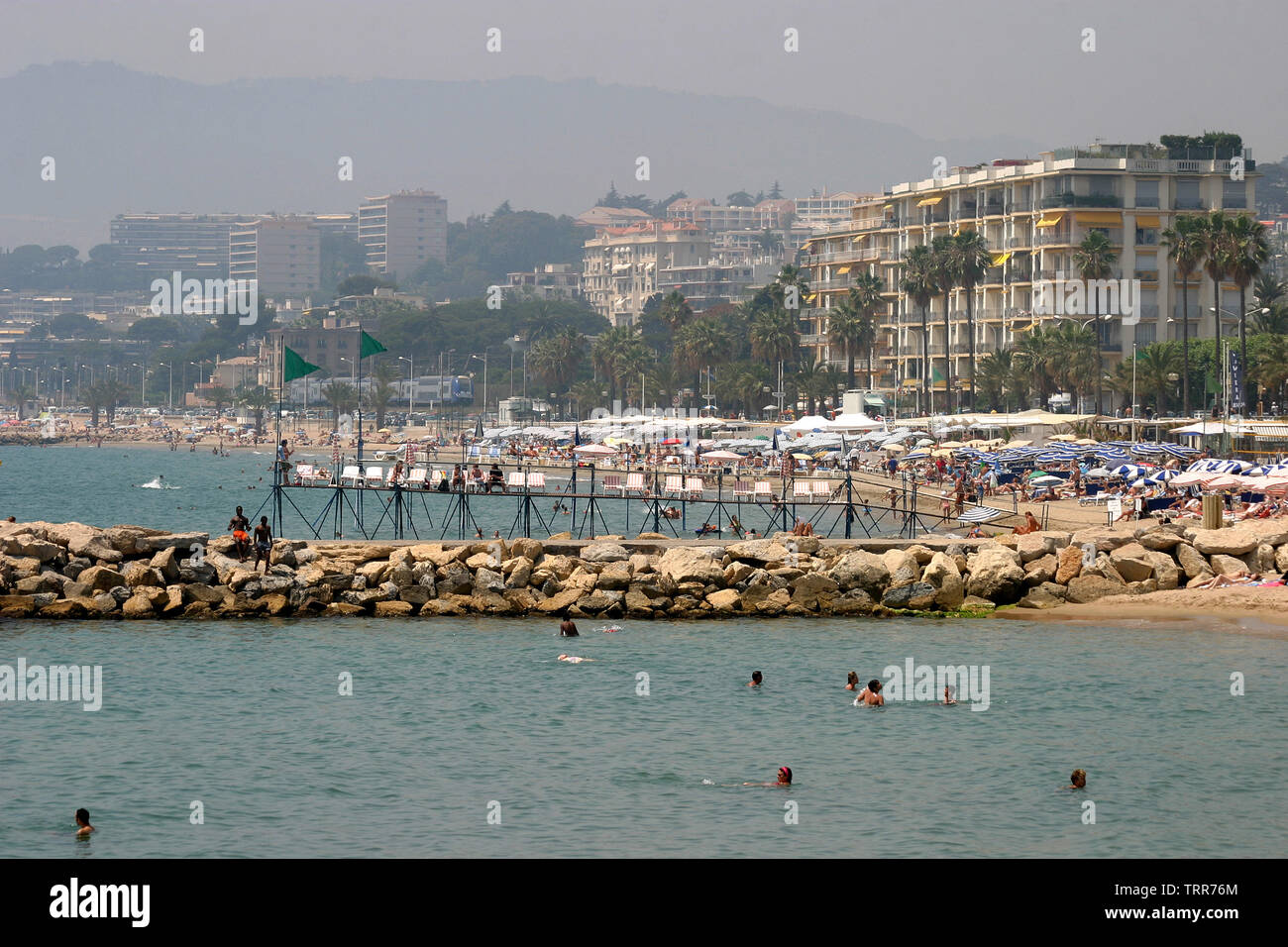 People sunbathing Cannes Beach in Cannes, France. Cannes beachfront ...