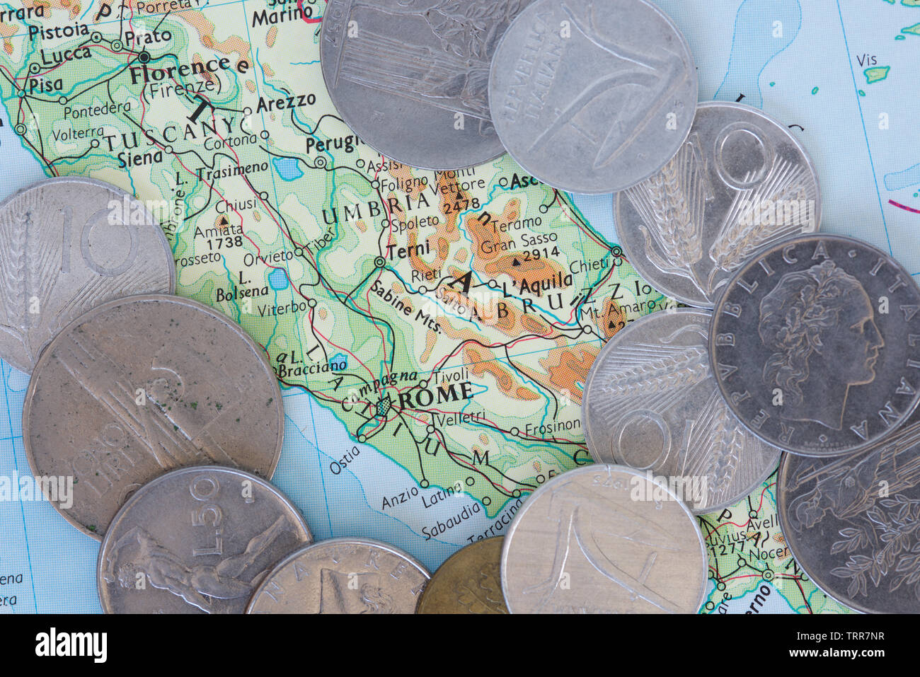 Various Italian coins on a map Stock Photo - Alamy