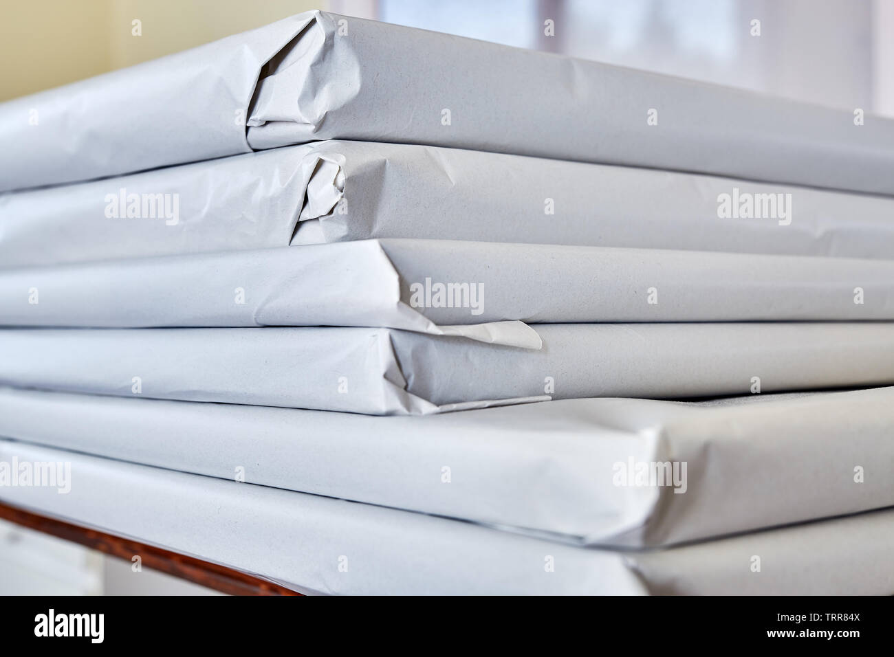 Articles wrapped in tissue paper Stock Photo - Alamy