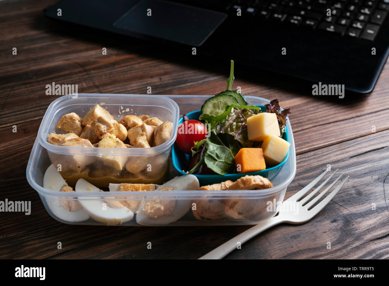 Healthy food in lunch box, on working table with laptop .eating at ...