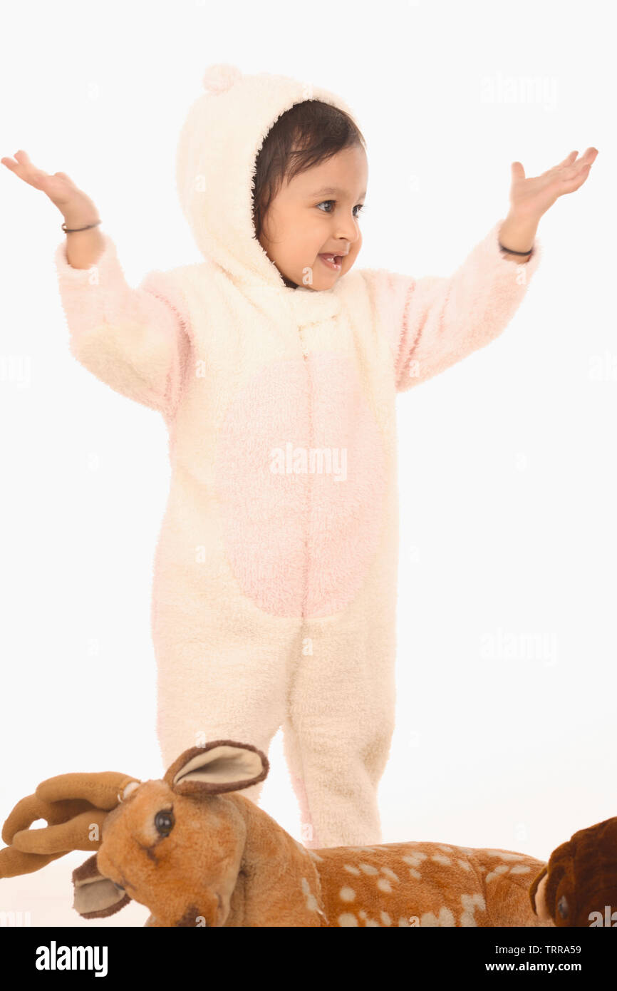 Baby boy standing beside a stuffed deer Stock Photo - Alamy