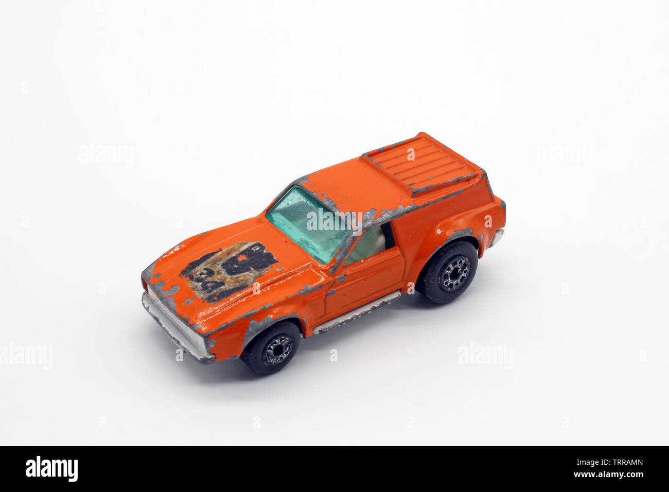 Vintage collectable orange toy car, isolated on white background, close ...