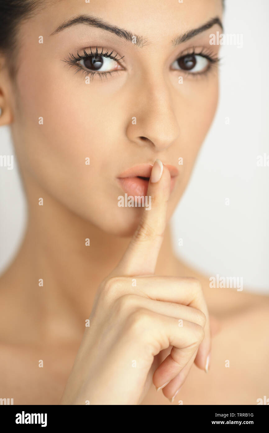 Finger on lips india hi-res stock photography and images - Alamy