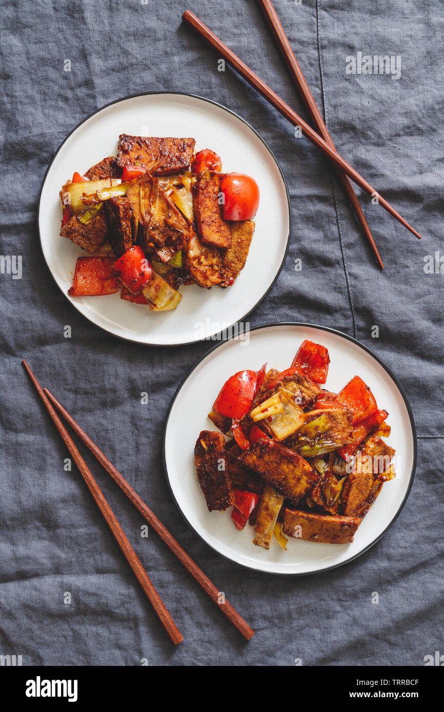 Szechuan traditional dish Hui Guo Rou, spicy roasted pork with leek and ...