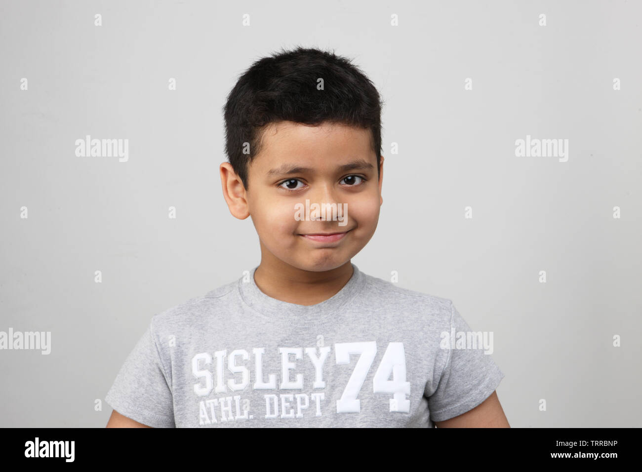 Boy smirking hi-res stock photography and images - Alamy