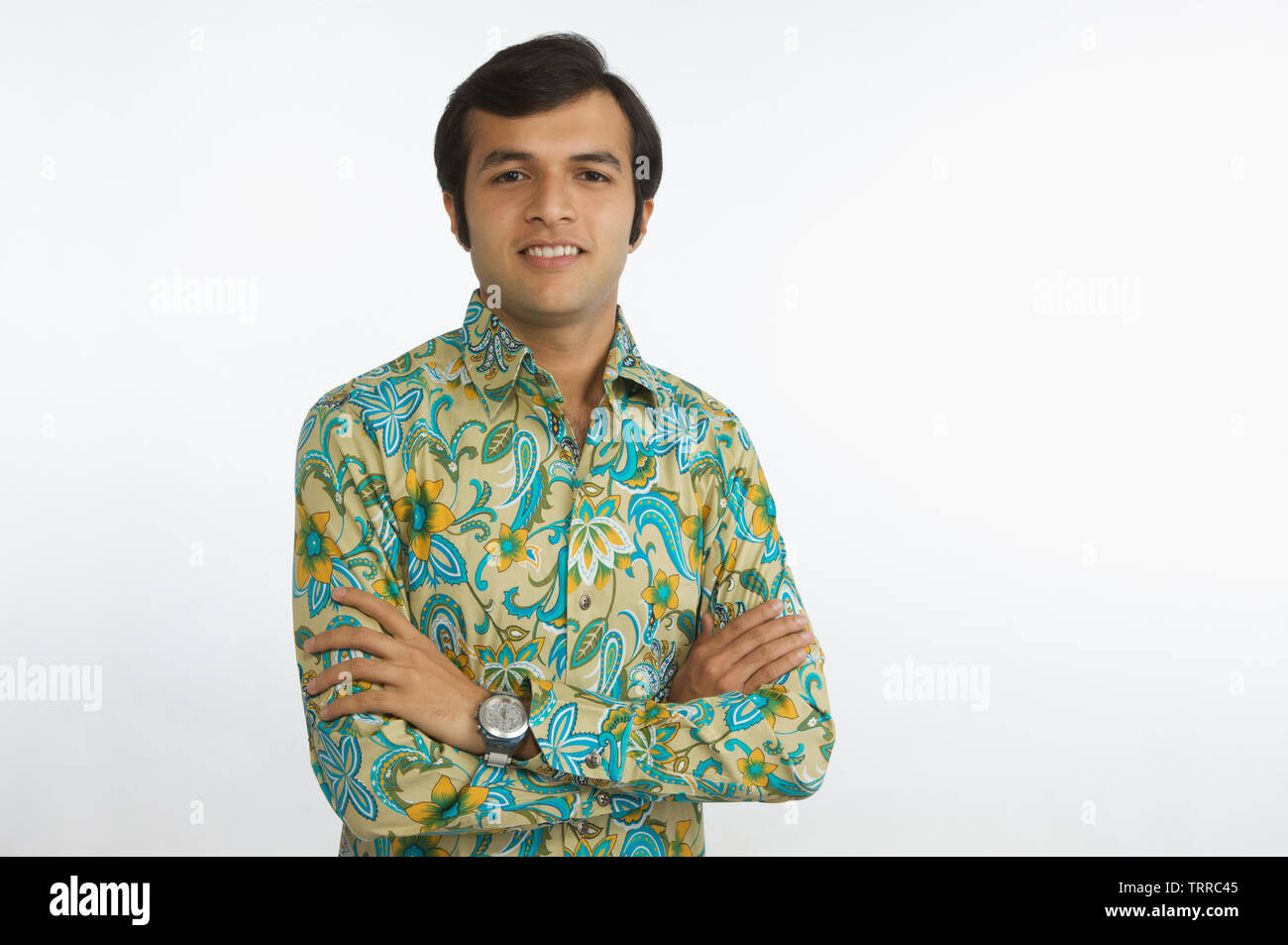 Portrait of a man smiling with arms crossed Stock Photo - Alamy