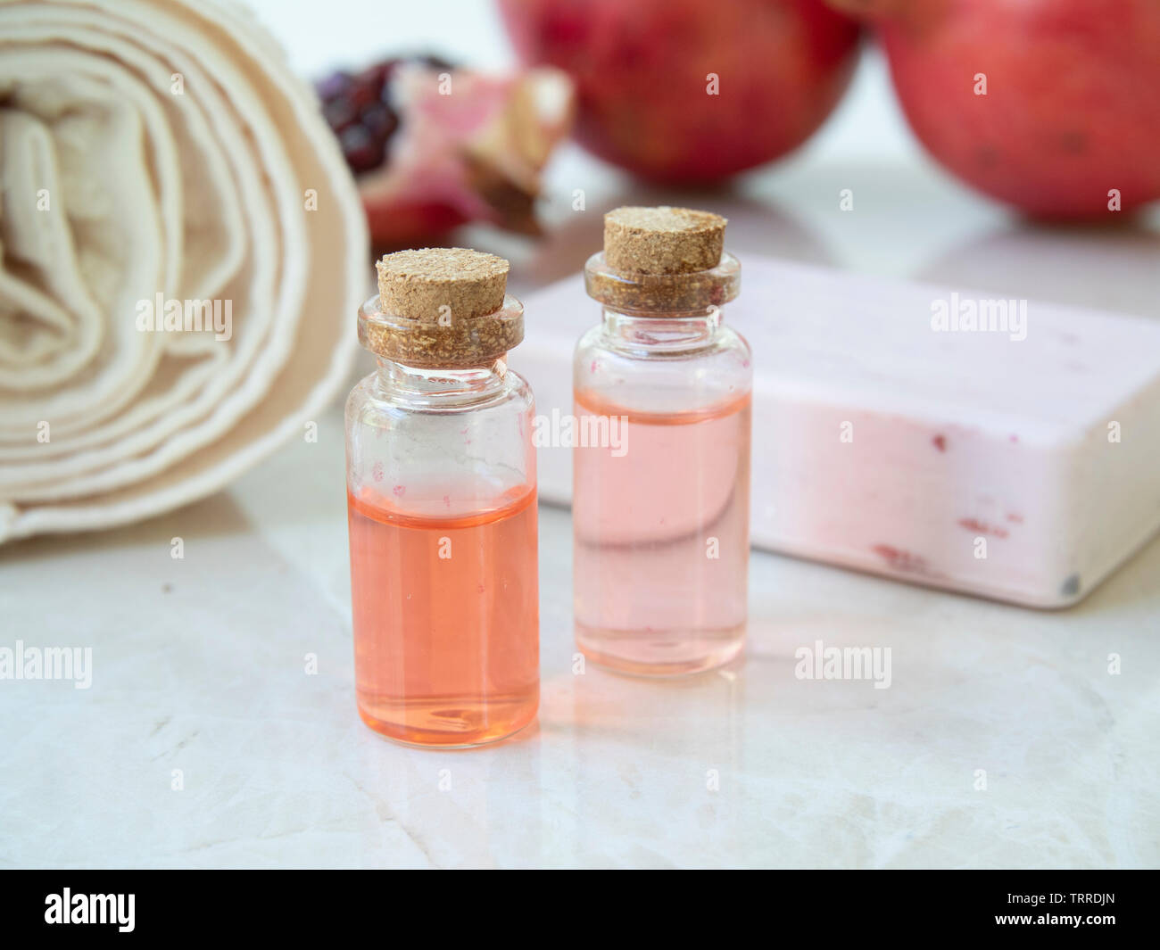 Two bottles of fruit extract and fruit soap Stock Photo - Alamy
