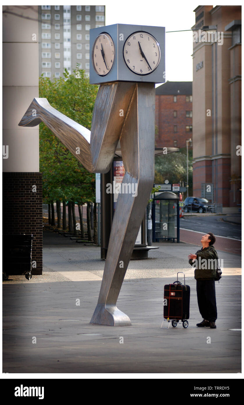 Traveller at the 'running man' clock in Glasgow Picture Copyright Chris ...