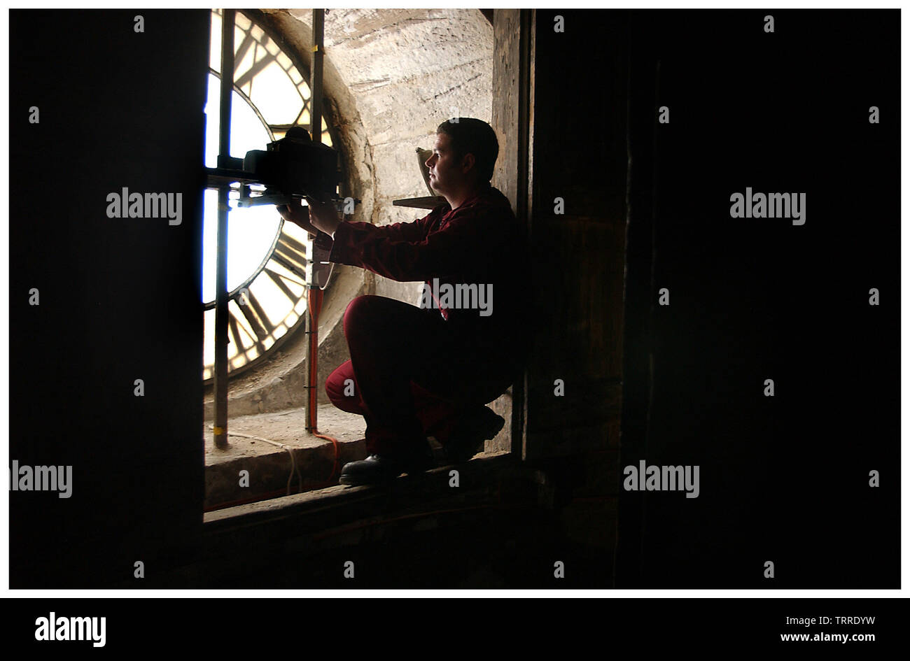 Man working on the clock at the gallery of modern art Picture Copyright ...