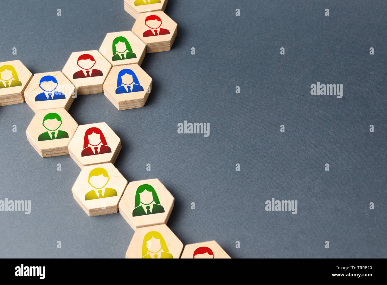 Symbols of employees on the chains of hexagons. The concept of business ...