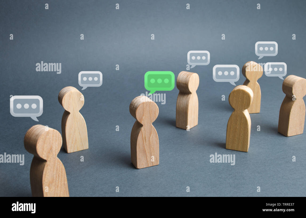 A lot of people figures and comment clouds above their heads. The ...