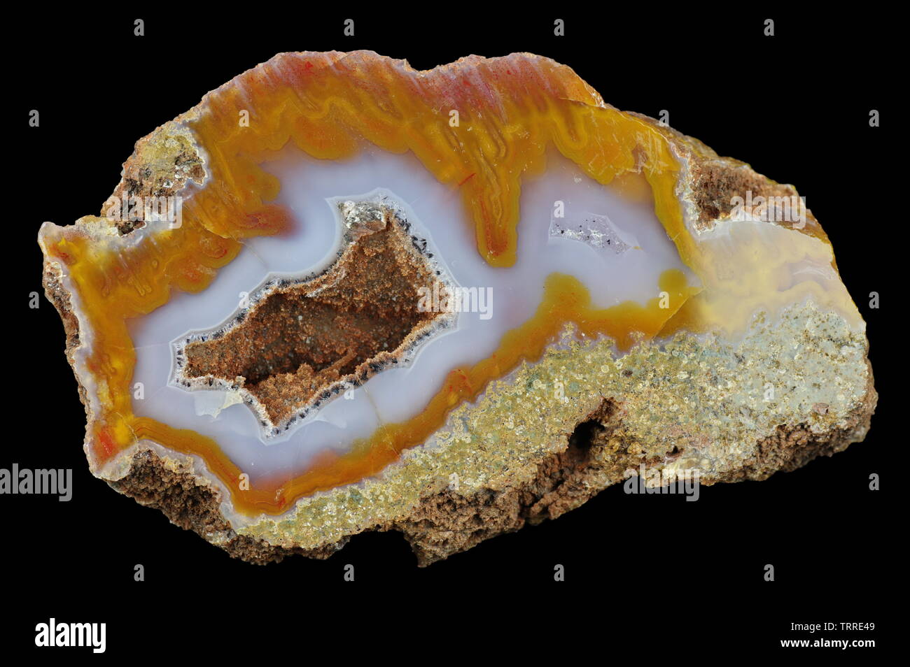 A cross-section of agate. Stalactite agate filled with milky white ...