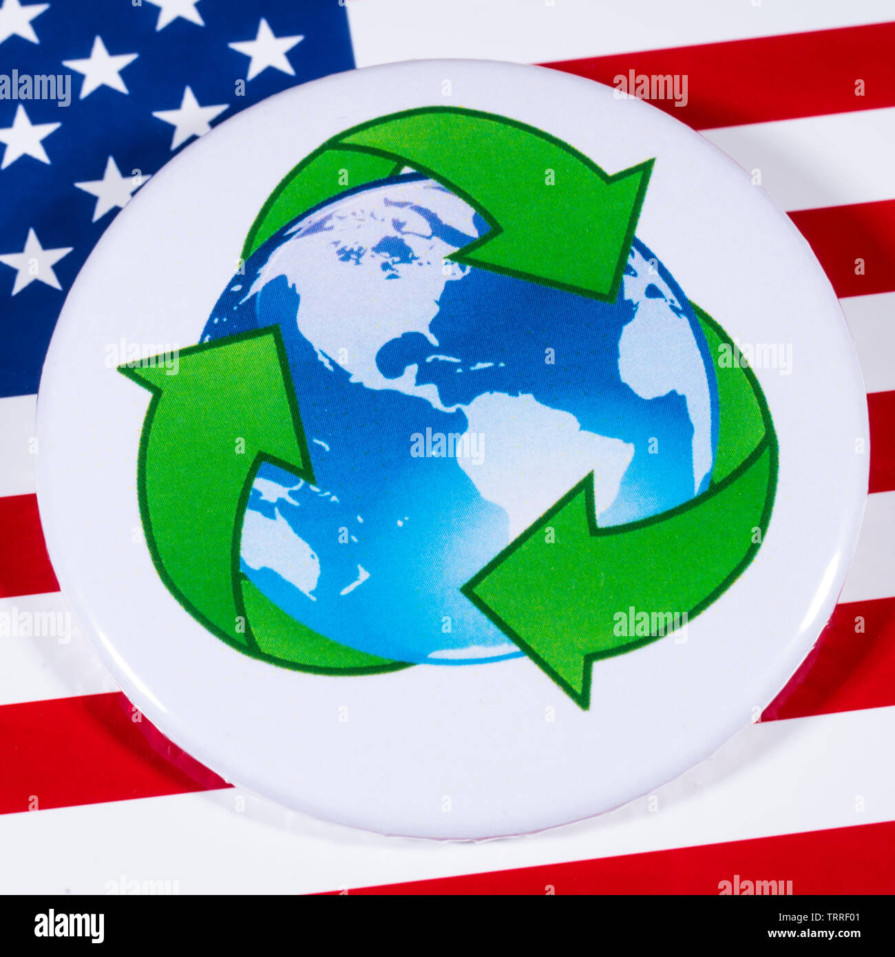 London, UK - May 29th 2019: Recycling Symbol, pictured over the flag of ...