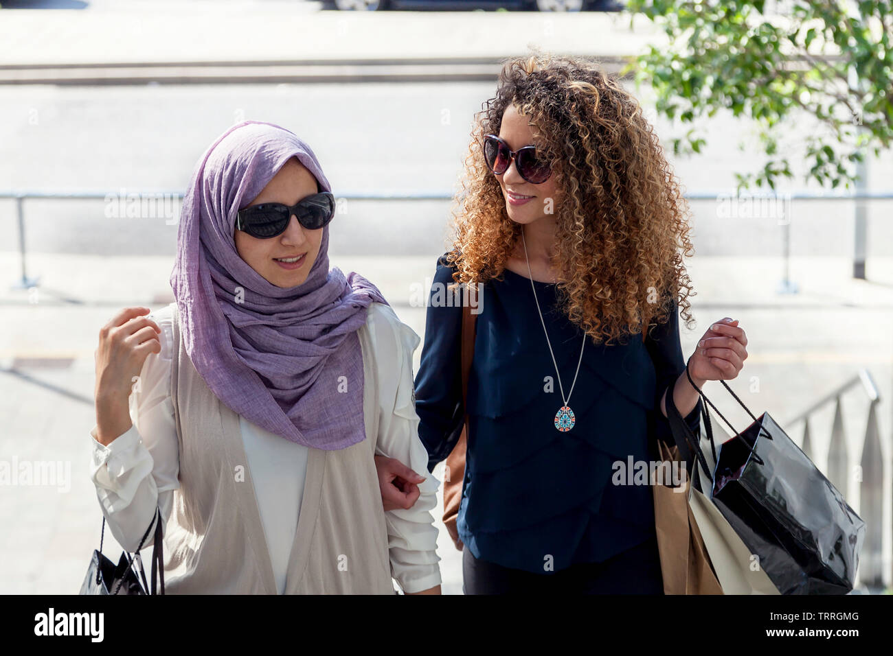Two arab women shopping bags hi-res stock photography and images - Alamy