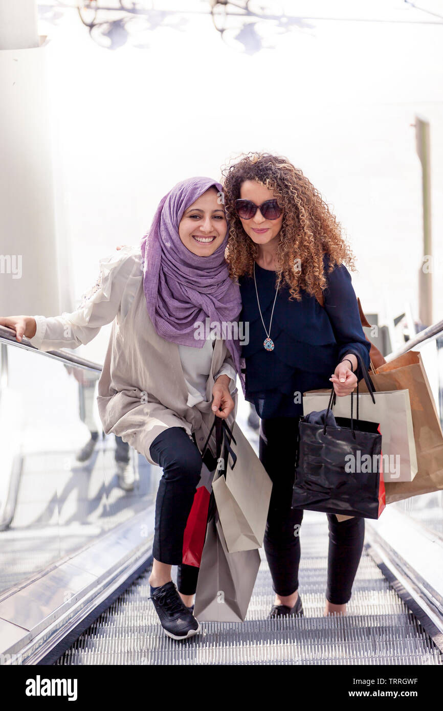 Two arab women shopping bags hi-res stock photography and images - Alamy