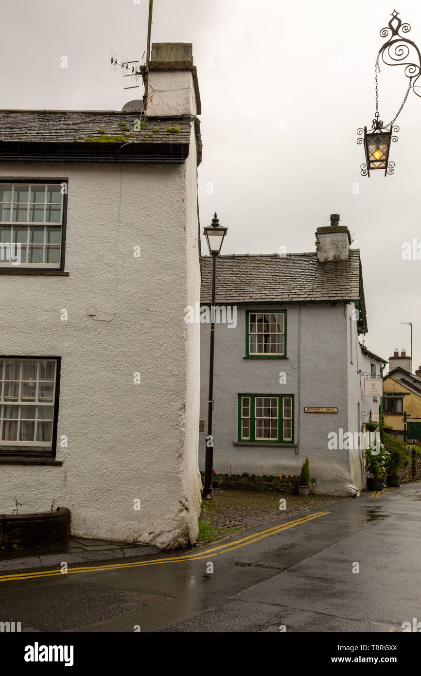 Street in Hawkshead, Cumbria, UK, in the rain in summer Stock Photo - Alamy