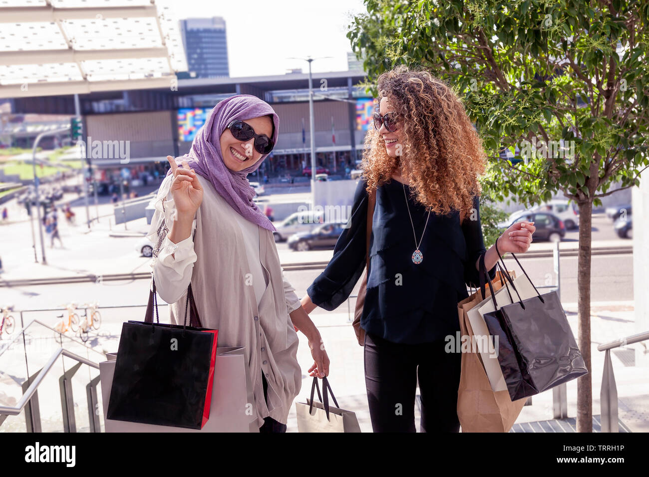 Two arab women shopping bags hi-res stock photography and images - Alamy