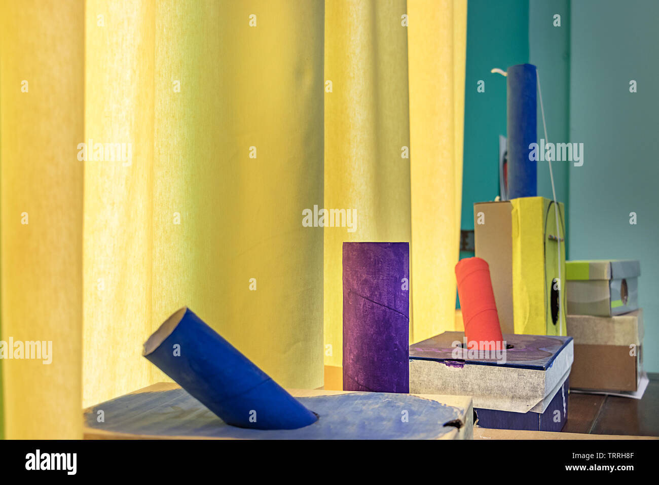 Musical instruments handmade with paperboard inside a music classroom ...