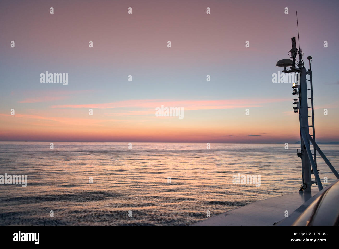 A ship mast with the position - navigation stern lights sailing in high ...