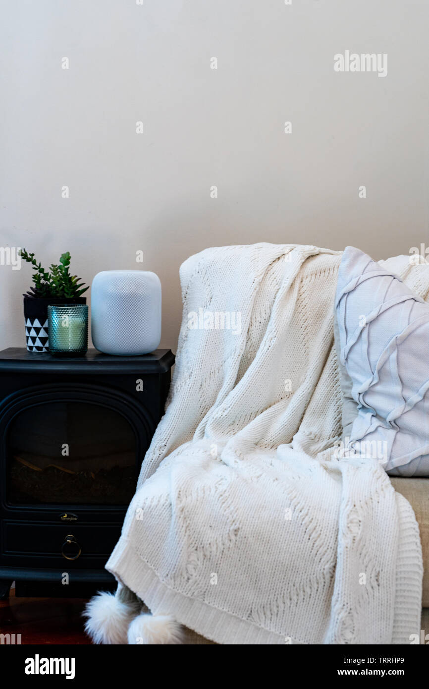 Apple Home pod in living room setting with white decor Stock Photo - Alamy