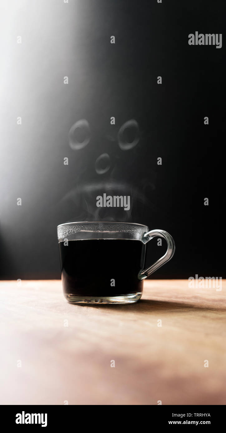 Hot coffee cup with steamy sad face. Glass coffee with unhappy face ...