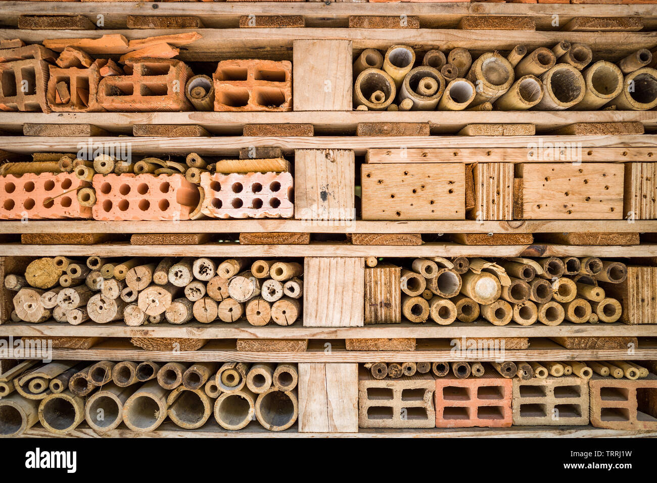 Small structure and holes built and sorted by wood, bamboos and brown ...