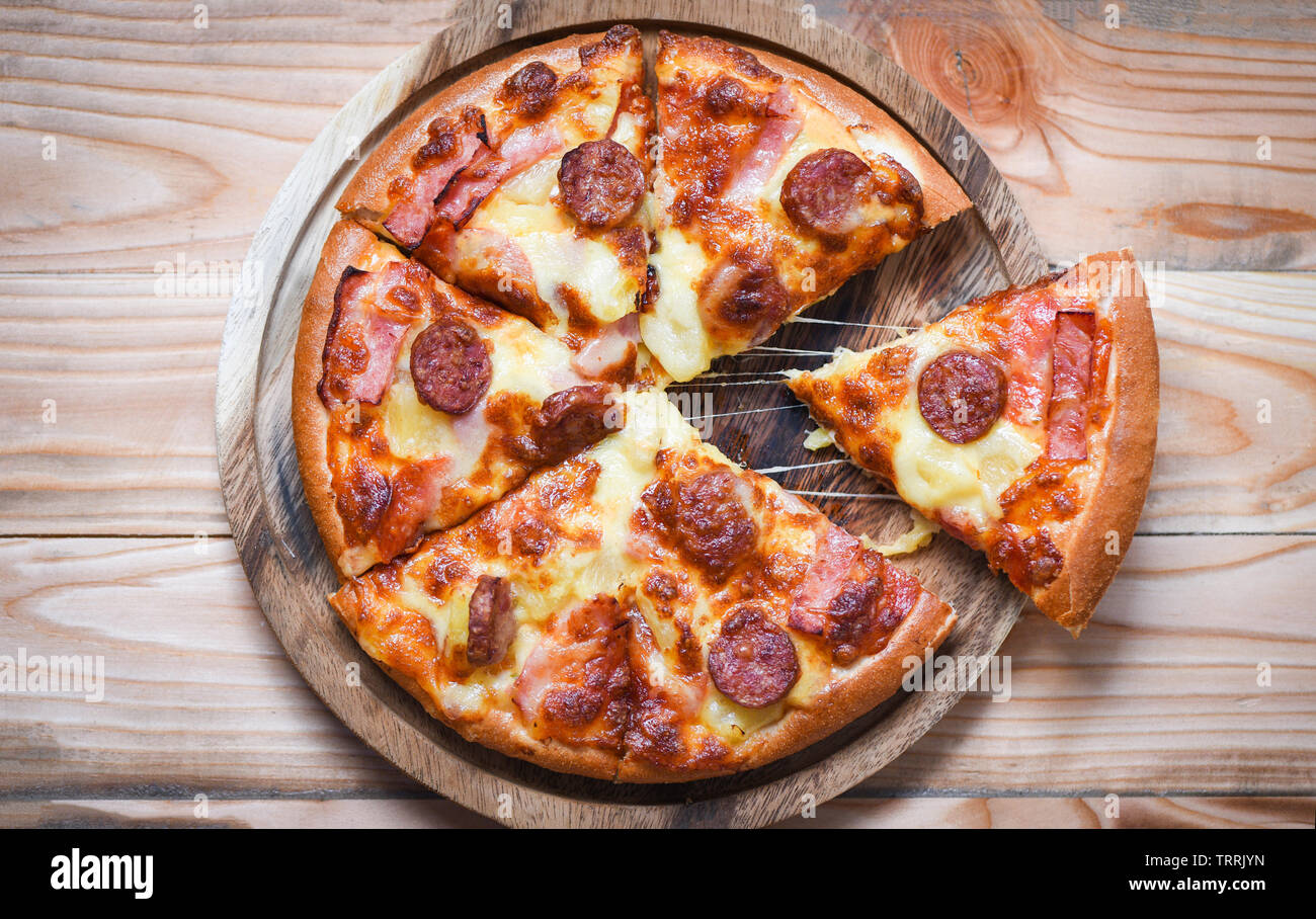 Pizza on wooden tray top view / delicious tasty fast food italian ...