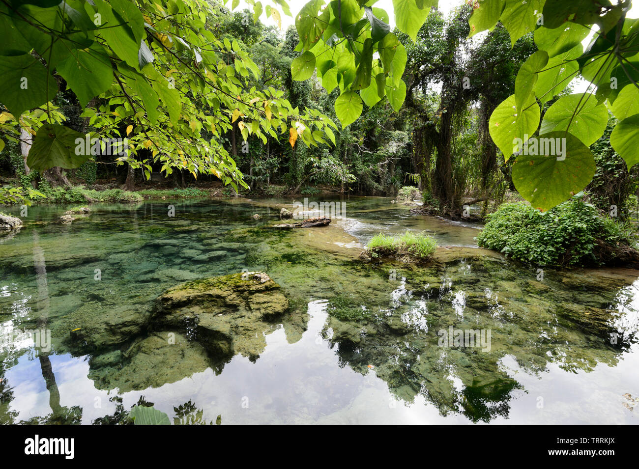 Water reflections on a scenic stretch of the Rarru Rentapao River near ...