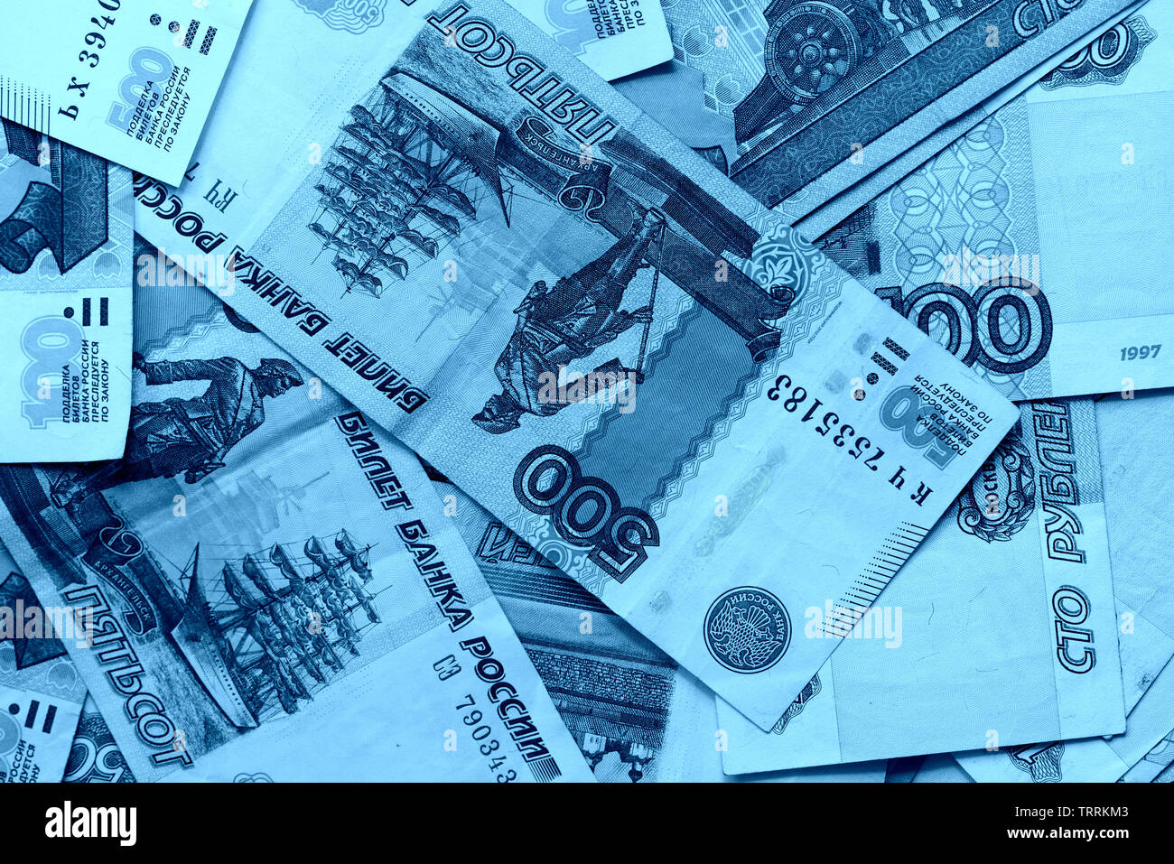 Different bills of Russian rubles close up. Money background blue color ...