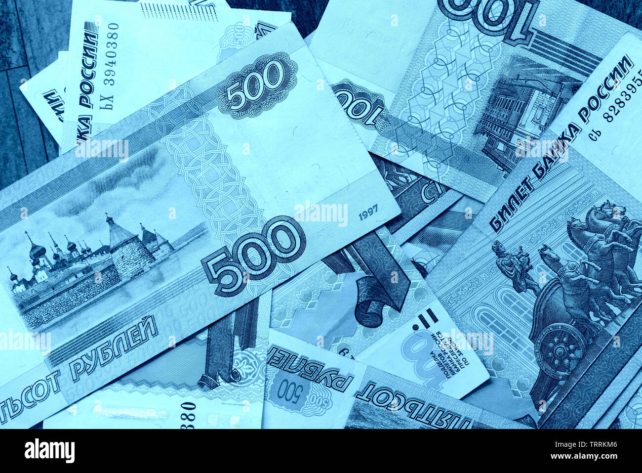 Different bills of Russian rubles close up. Money background blue color ...
