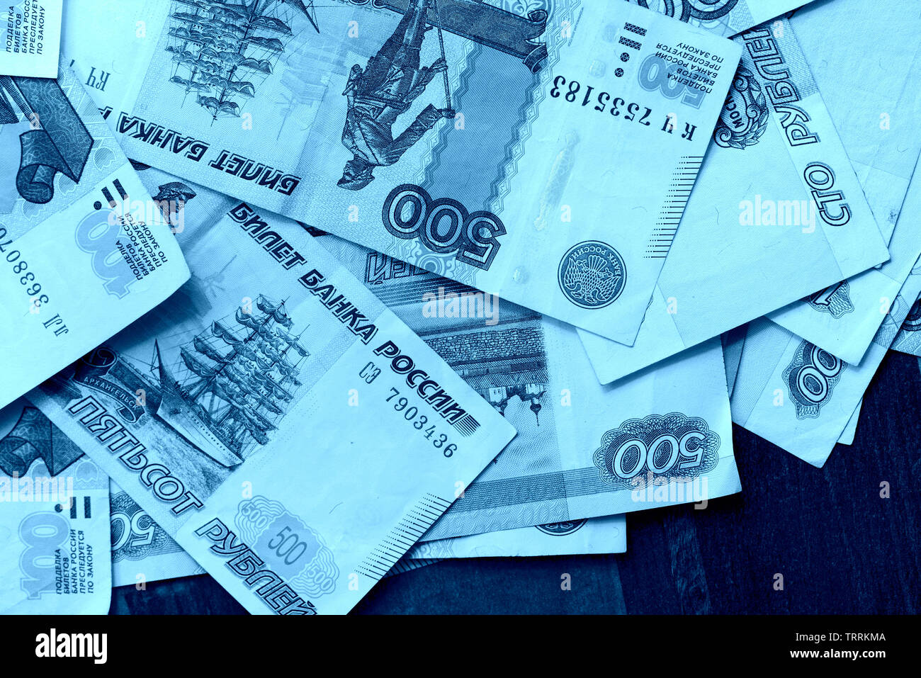 Different bills of Russian rubles close up. Money background blue color ...