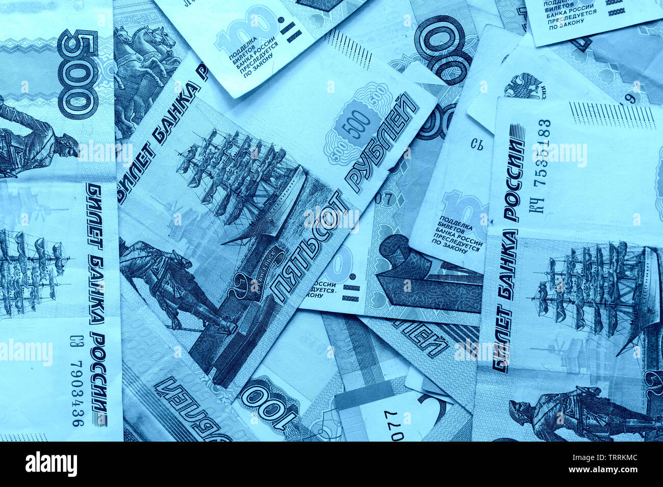 Different bills of Russian rubles close up. Money background blue color ...
