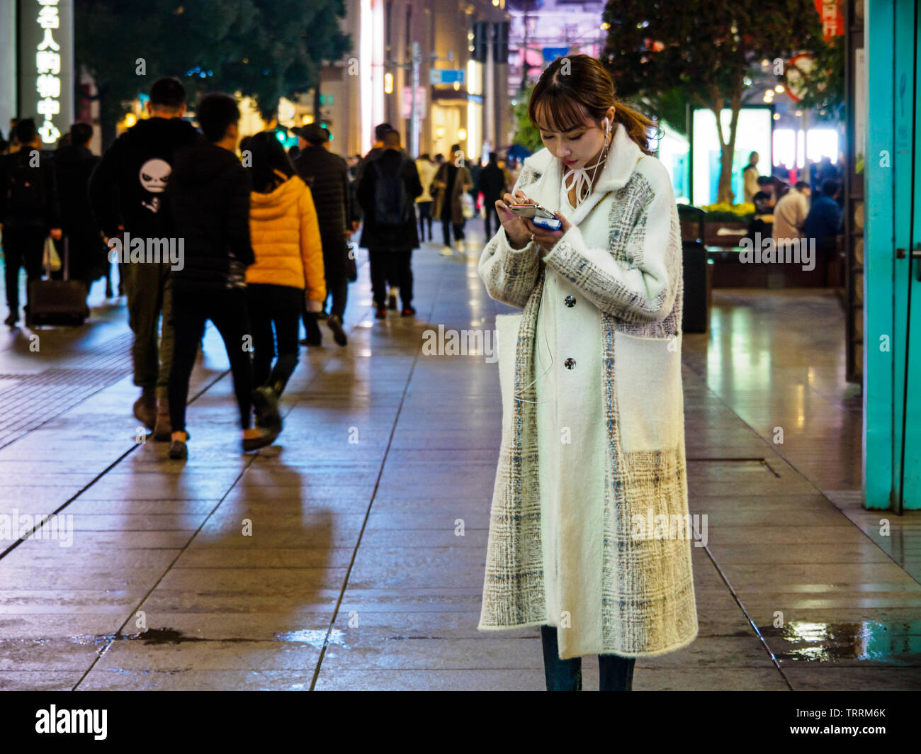 SHANGHAI, CHINA - 12 MAR 2019 –An attractive young Chinese lady on her ...