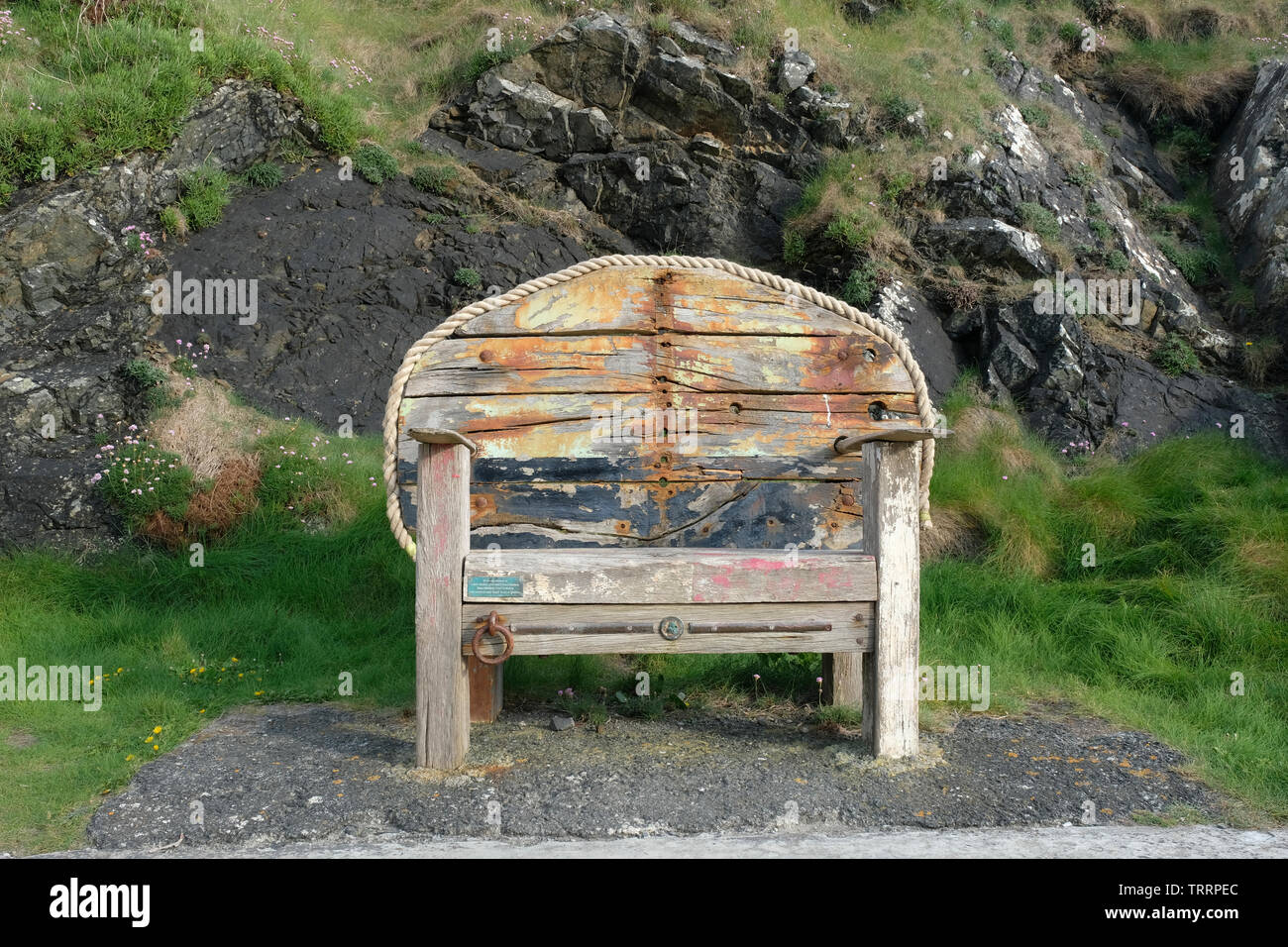Memorial bench in the fishing port of Mullion in Cornwall Stock Photo ...