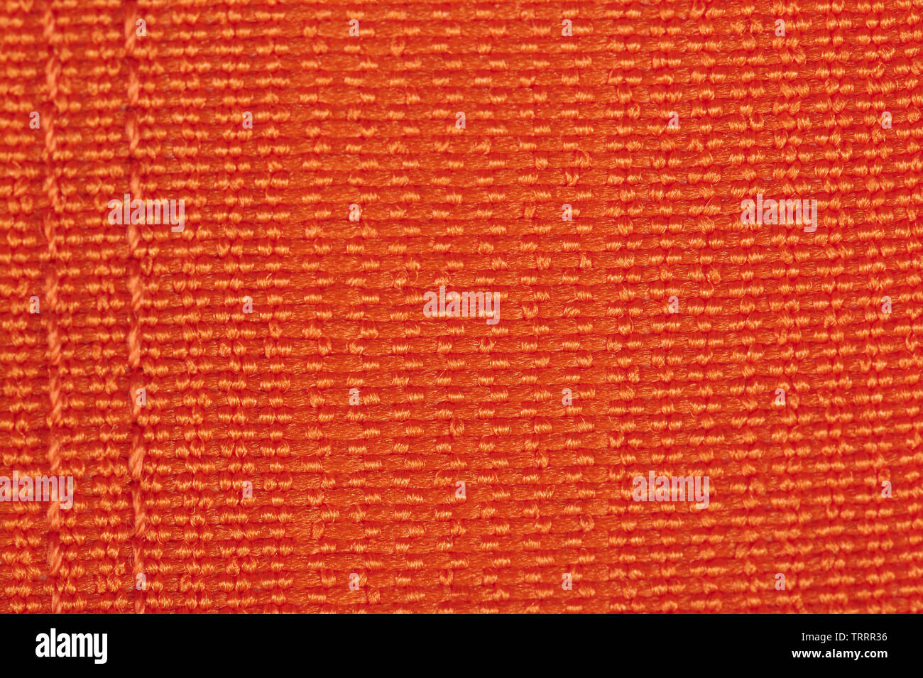 Orange color textile surface close up view Stock Photo - Alamy