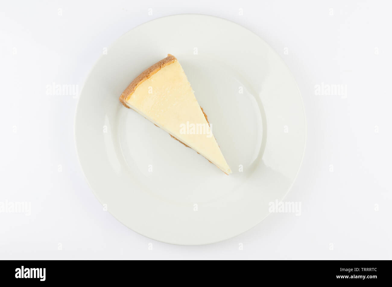 One piece of cheesecake on plate above top view isolated Stock Photo ...