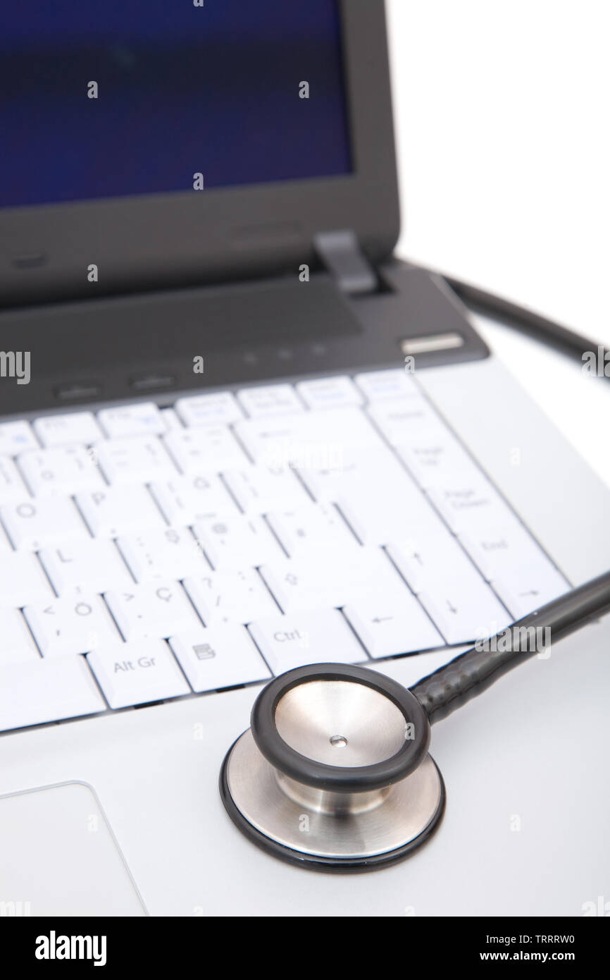 modern laptop close on white with stethoscope Stock Photo - Alamy