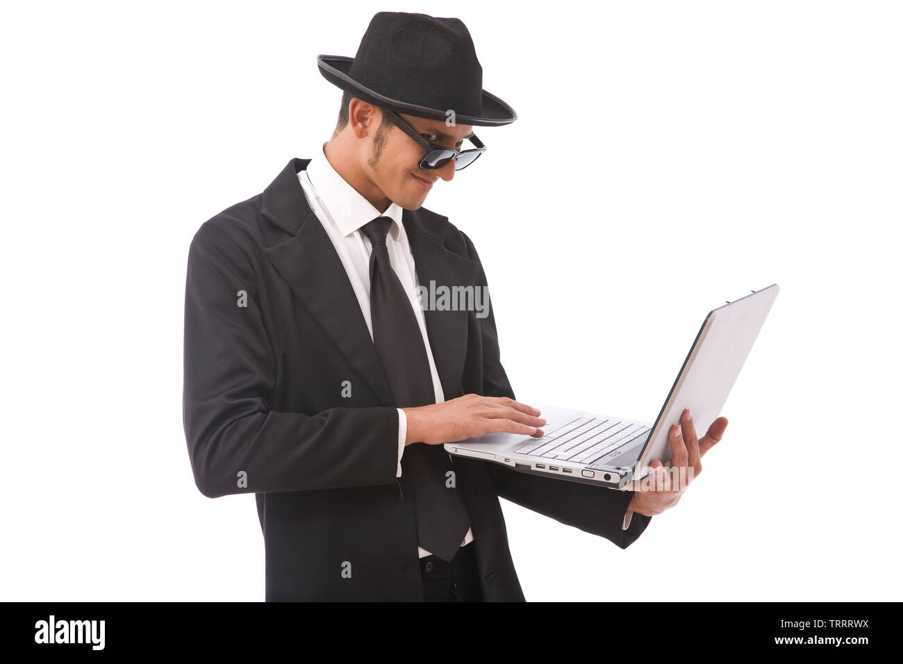 funny looking computer hacker with a laptop on white Stock Photo - Alamy