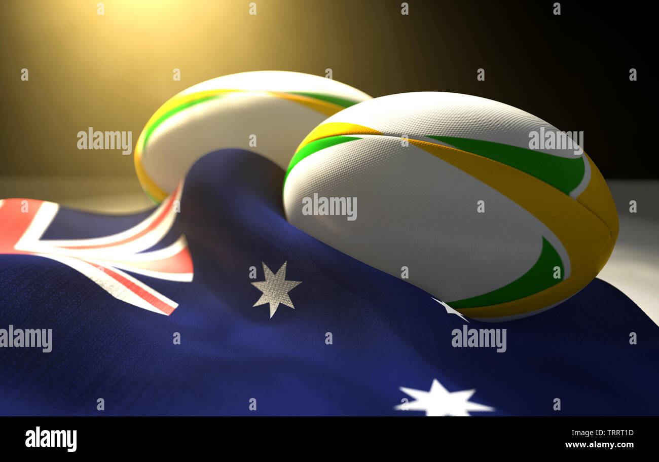 Two regular rugby balls with color design elements resting on a draped ...