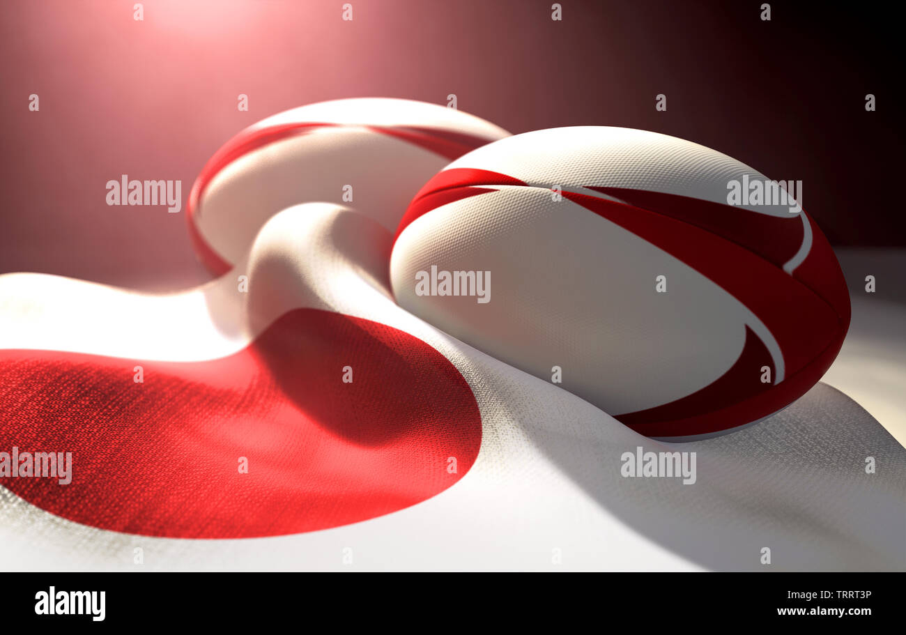 Two regular rugby balls with color design elements resting on a draped ...