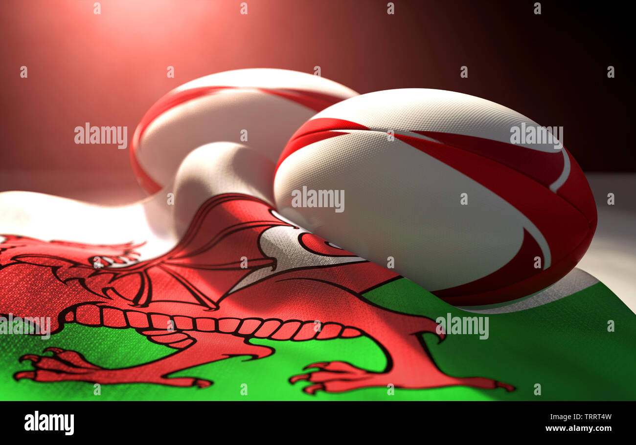 Two regular rugby balls with color design elements resting on a draped ...